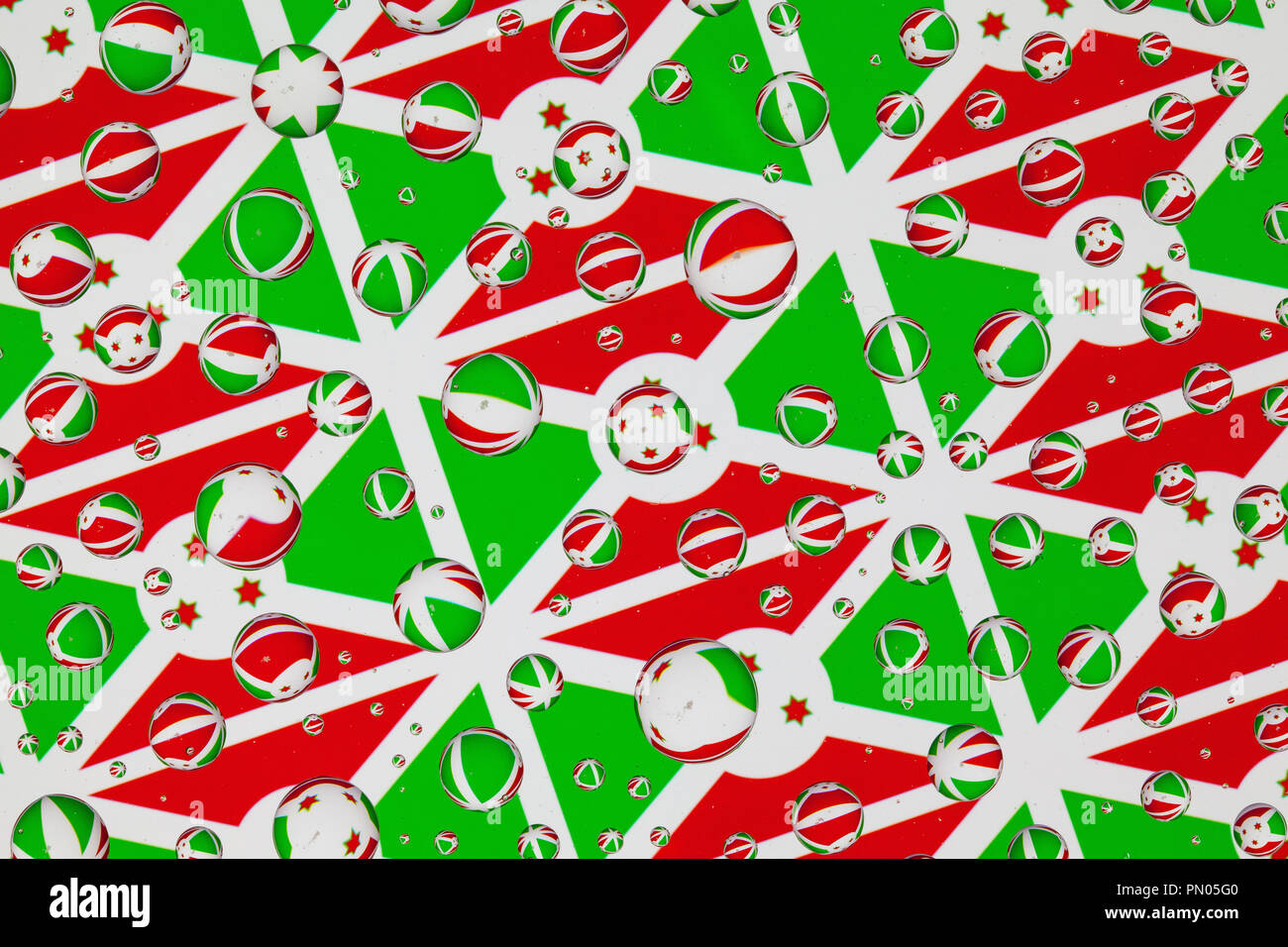 Flags of Burundi, behind a glass covered with rain drops.Pattern from ...