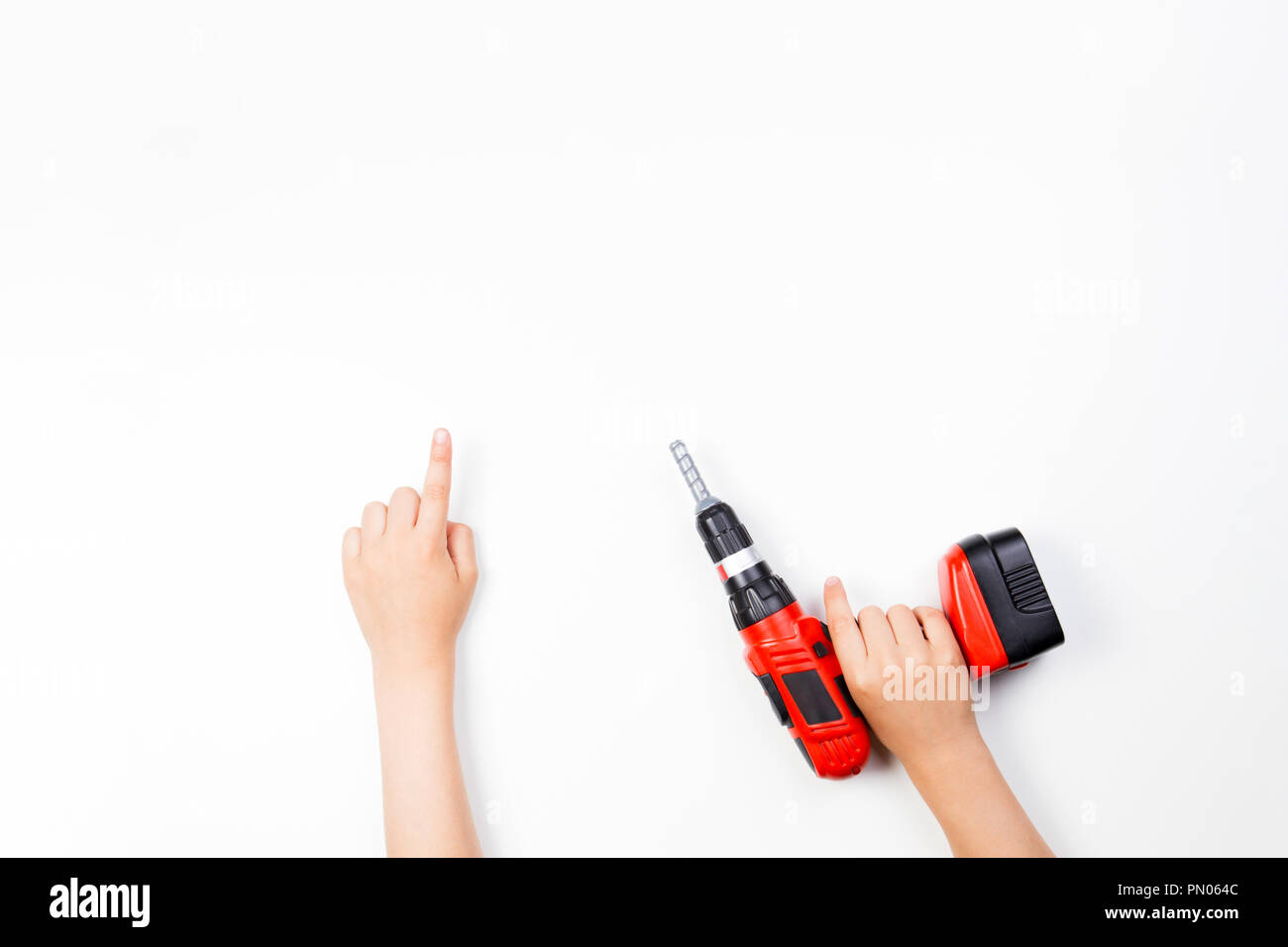 Child's hands on white background. Boy pointing finger up and holding ...