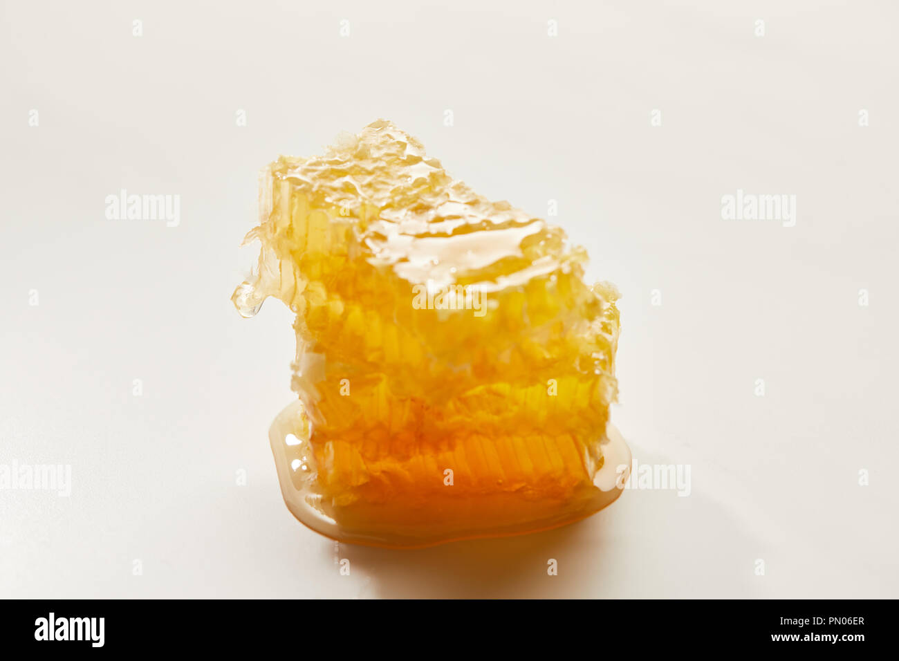 close up view of natural beeswax on white background Stock Photo - Alamy
