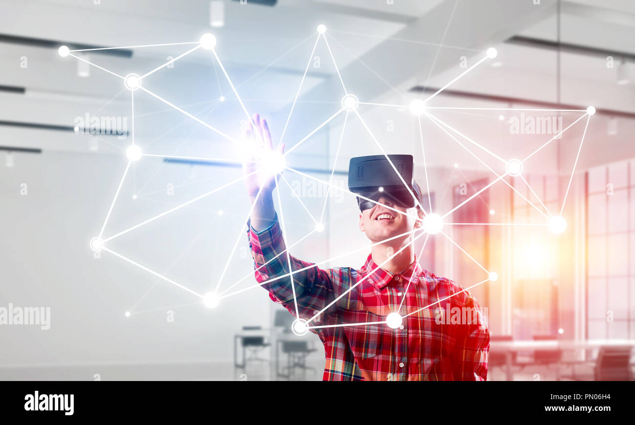 Guy wearing checked shirt and virtual mask reaching hand to touch ...