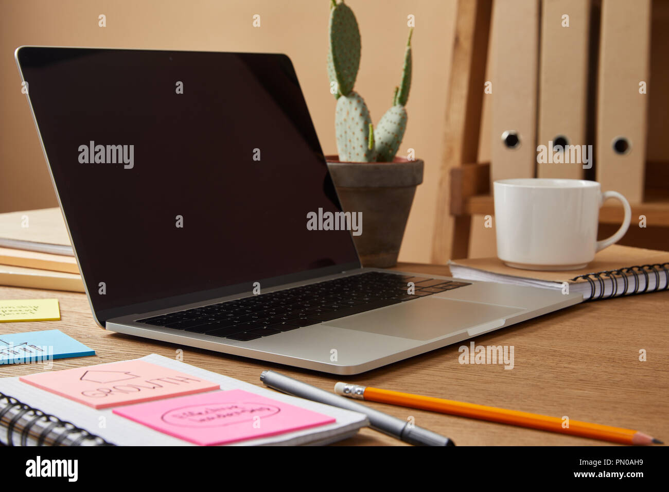 laptop with blank screen and paper stickers on tabletop Stock Photo - Alamy
