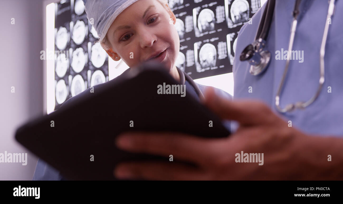 Doctors using devices in the office Stock Photo - Alamy
