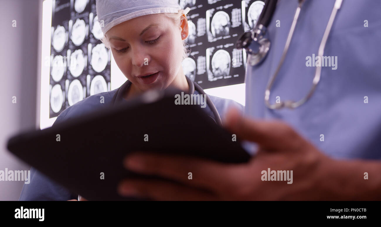 Doctors using devices in the office Stock Photo - Alamy