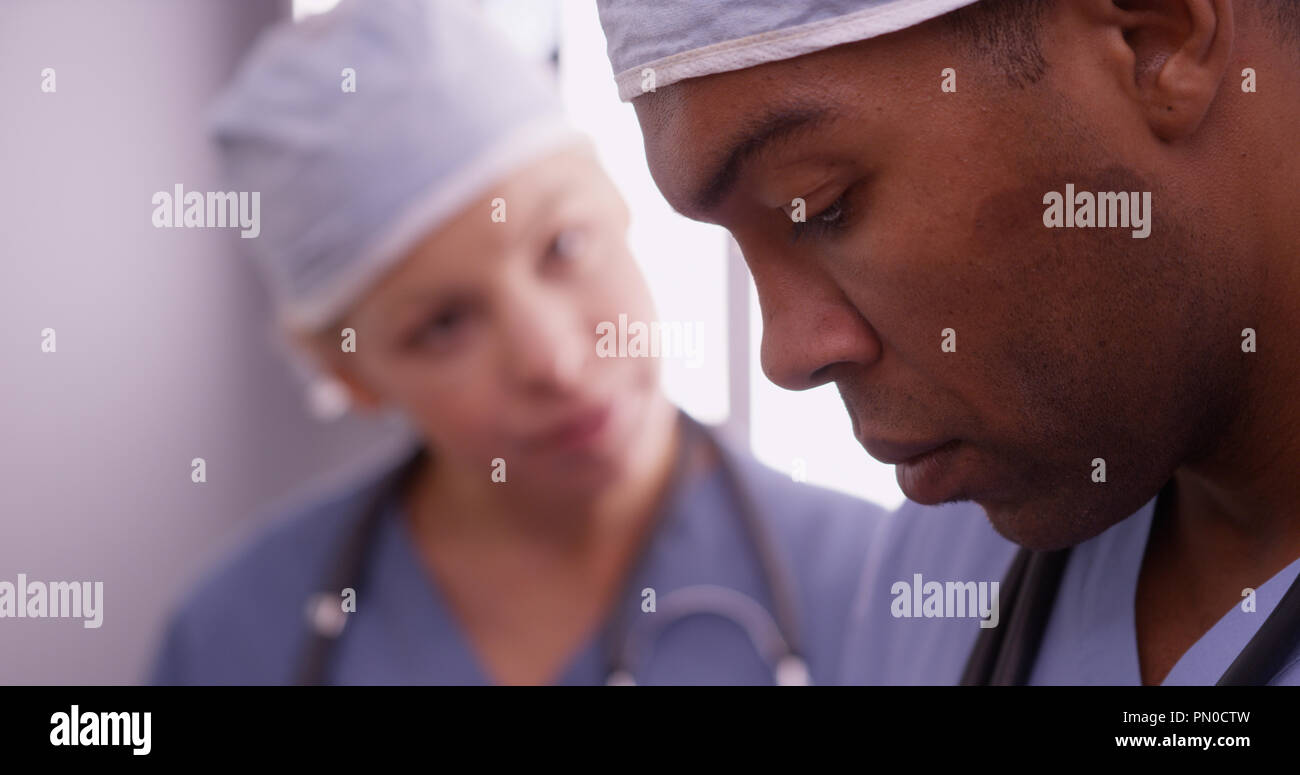 Doctors going over notes in the office Stock Photo - Alamy