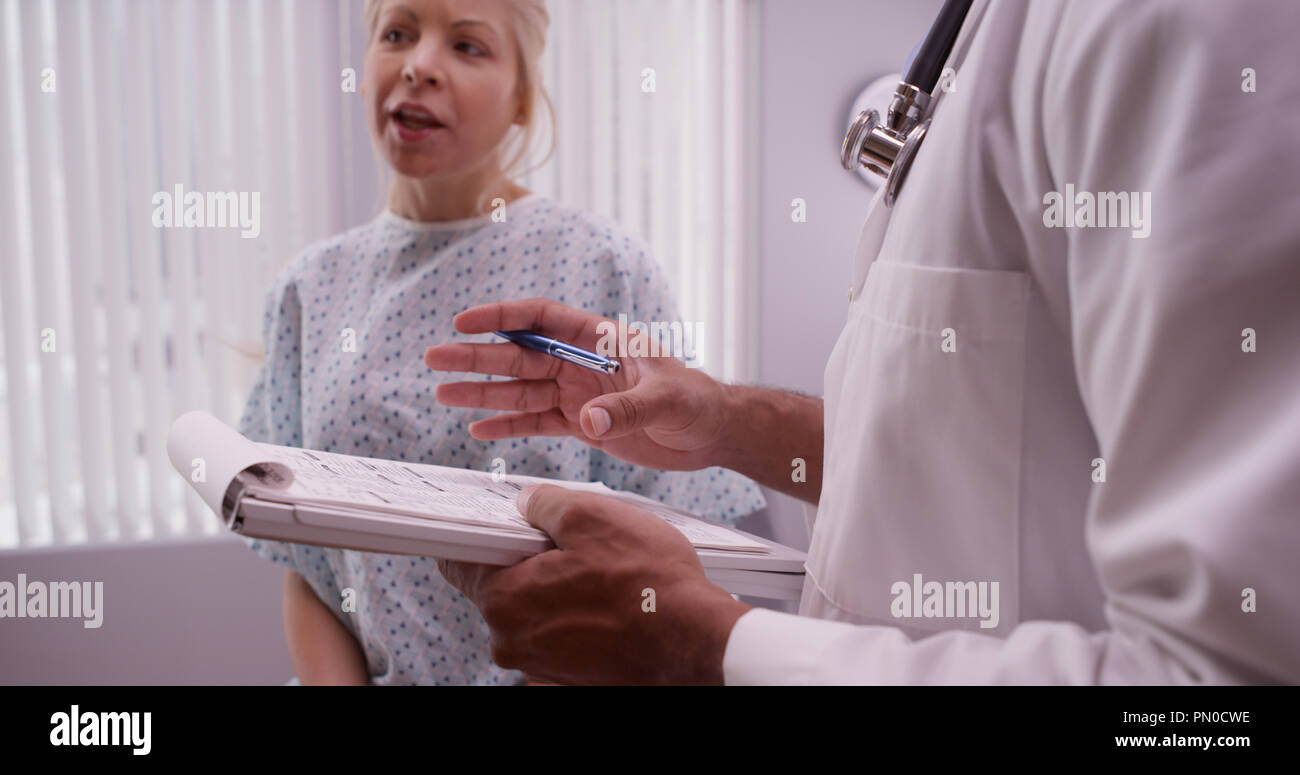 African doctor asking patient medical questions Stock Photo - Alamy