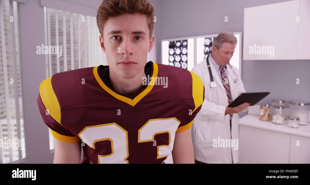 Handsome caucasian football athlete having doctor consultation Stock ...