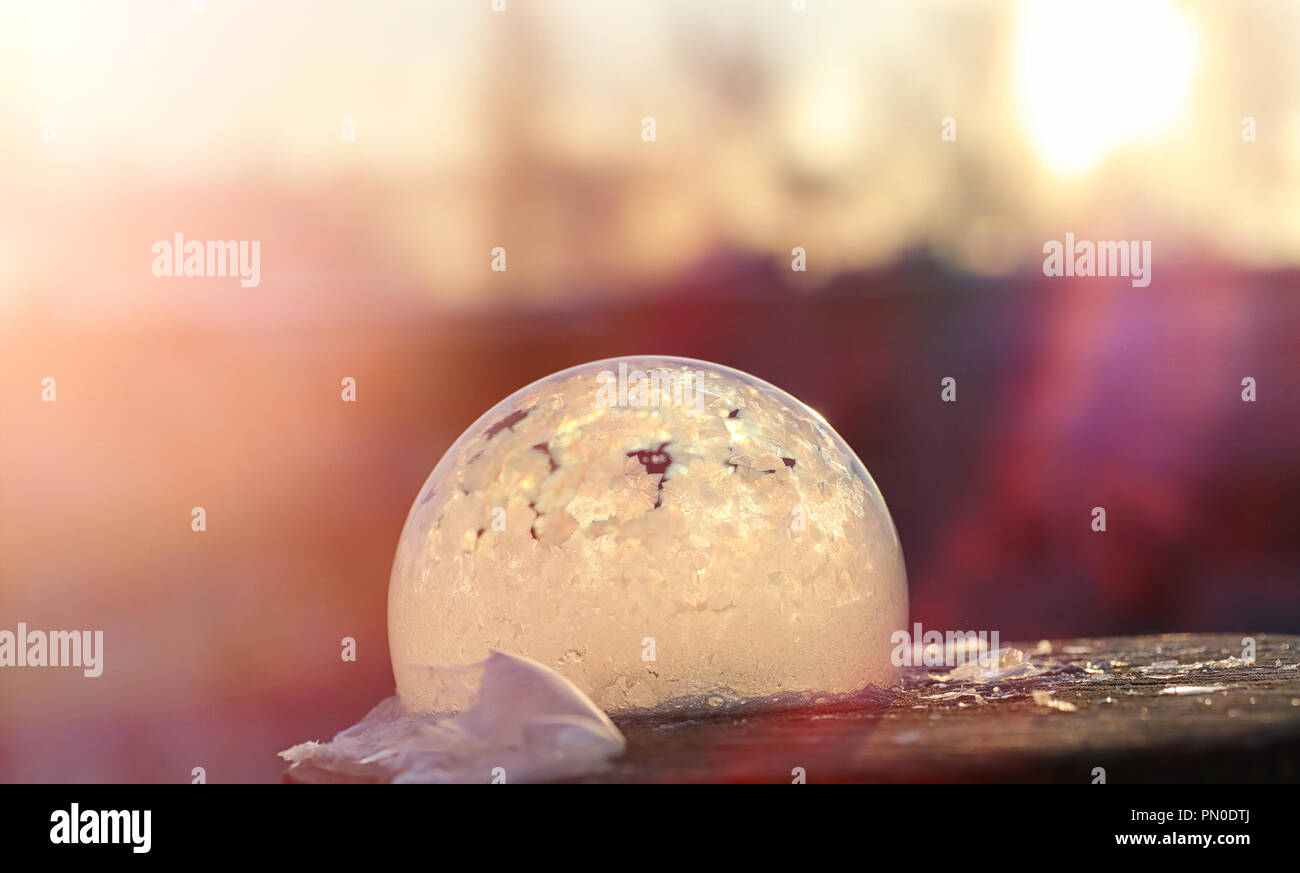Soap bubbles freeze in the cold. Winter soapy water freezes in t Stock ...