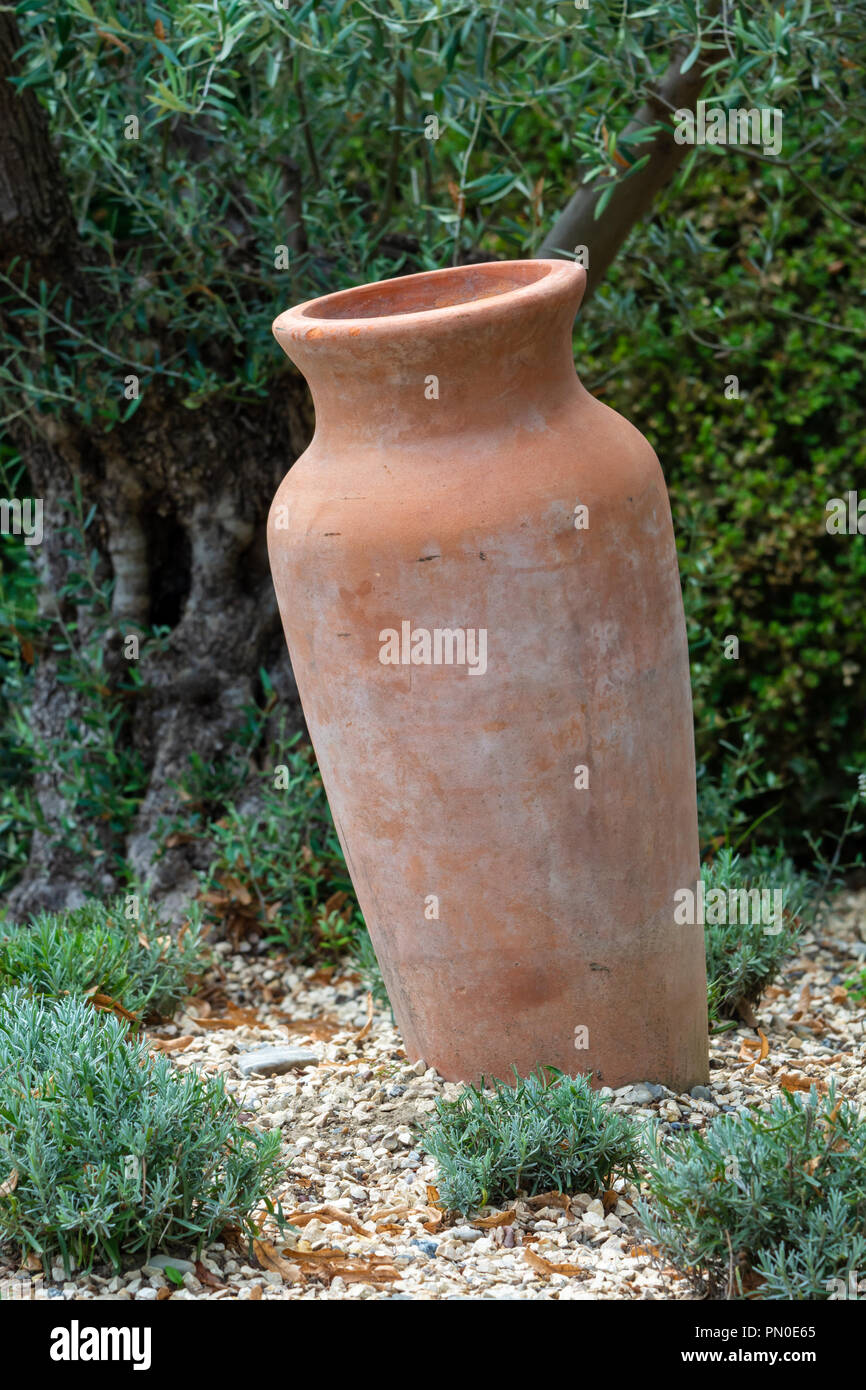 Decorative antique Amphora in the garden Stock Photo - Alamy