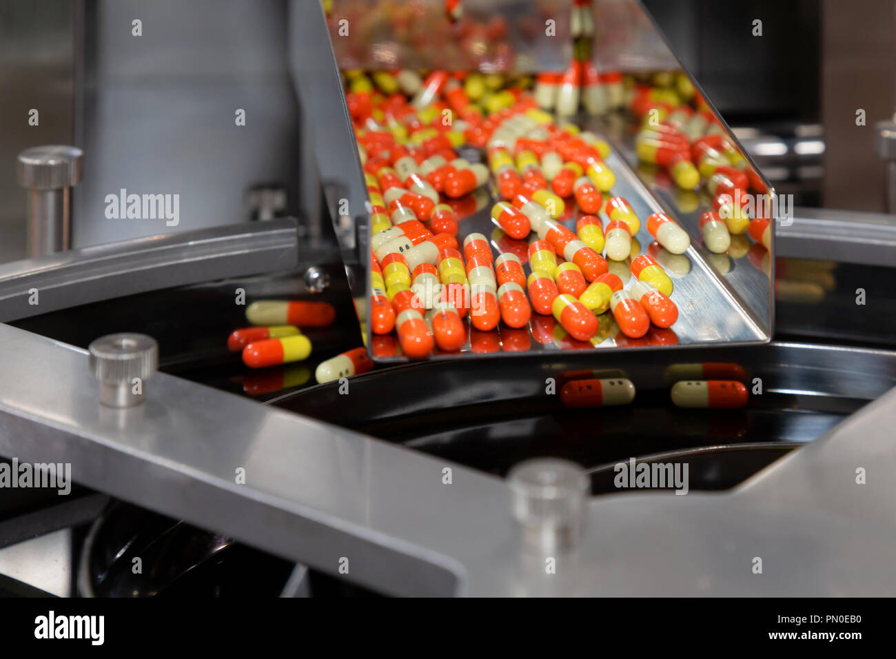 pharmacy medicine capsule pill in production line at medical factory ...