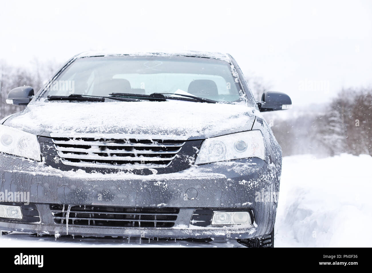 The car stands on a snow-covered road Stock Photo - Alamy