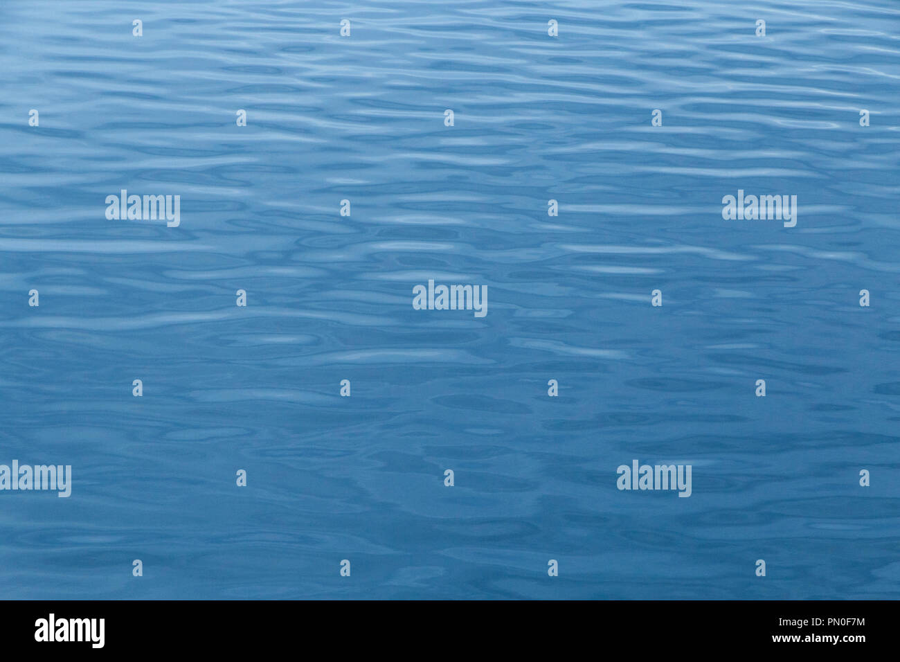 abstract blue background with water ripples Stock Photo - Alamy