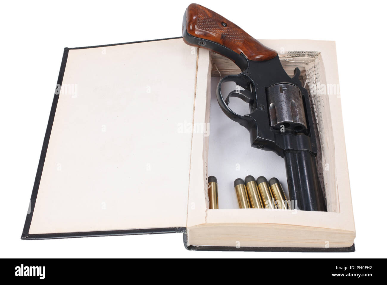 .38 caliber revolver gun with cartridges hidden in a book isolated on ...