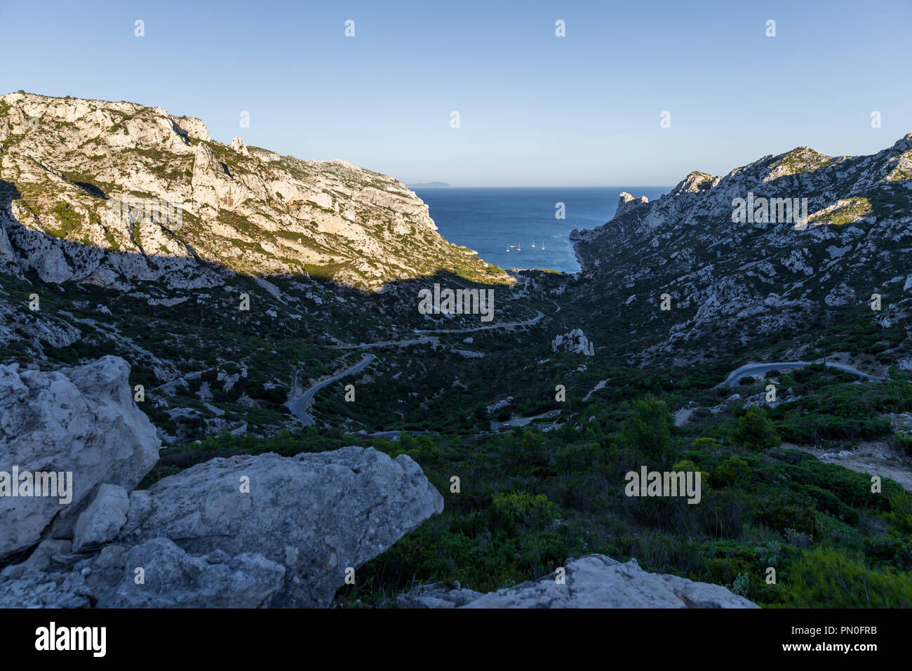 beautiful rocky mountains with green vegetation and tranquil sea view ...