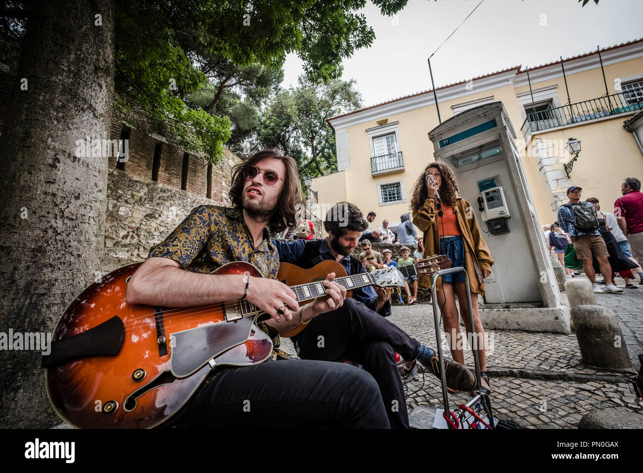 Street musicians at the streets of Lisbon Portugal Stock Photo - Alamy