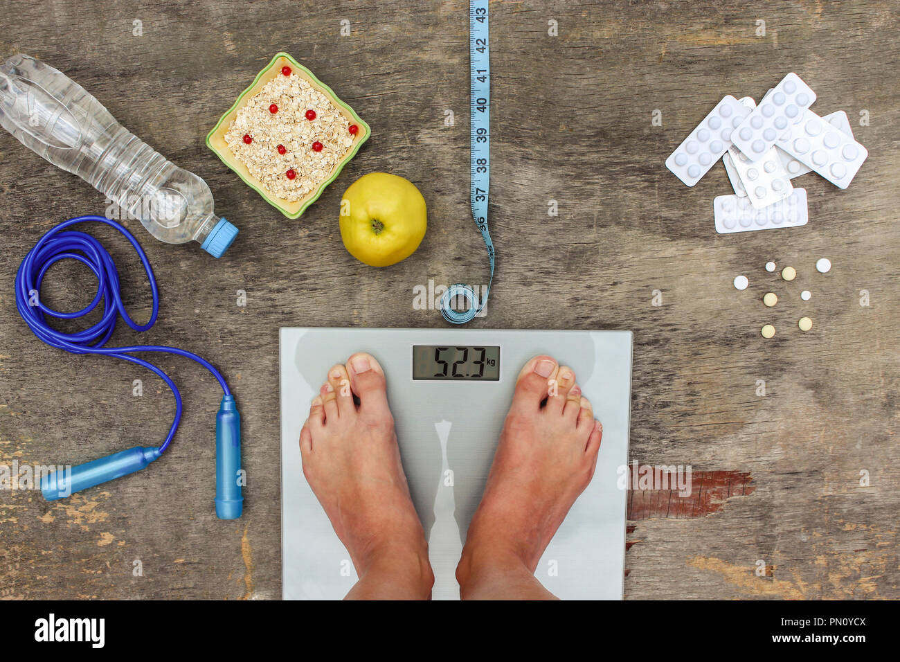 Concept of different ways to lose weight. Scales, tape measure, apple ...
