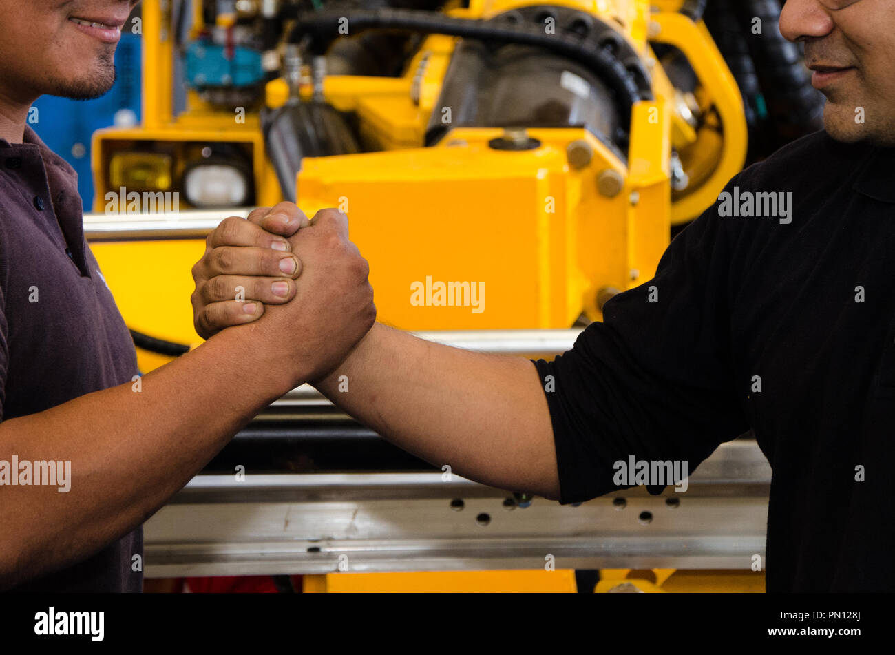 Handshake of construction worker at the construction site. Concept of ...