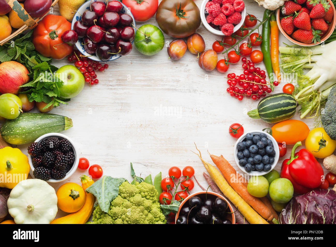 Healthy living, summer fruits vegetables berries arranged in a frame ...