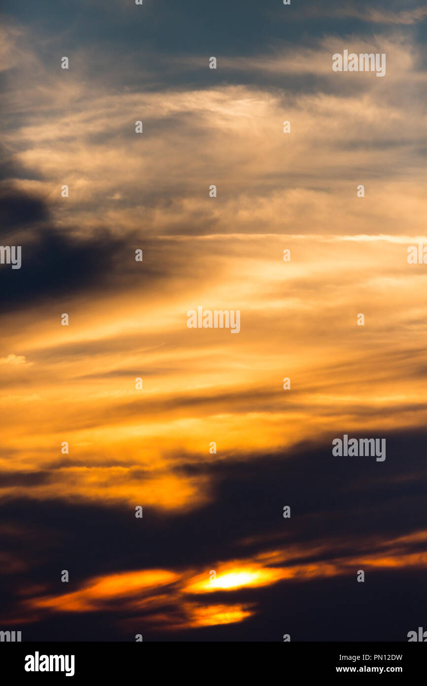 natural sunset in dramatic orange sky with clouds, blue sky Stock Photo ...