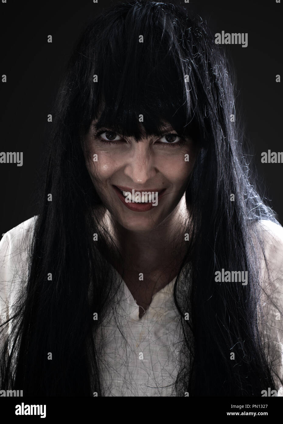 Mad and crasy halloween woman on black background. Horror Stock Photo ...