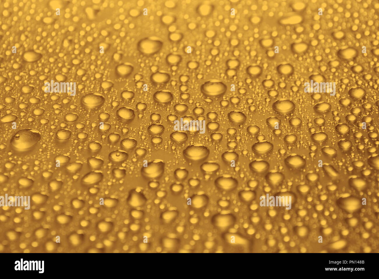 natural water drops on yellow background texture golden color Stock ...