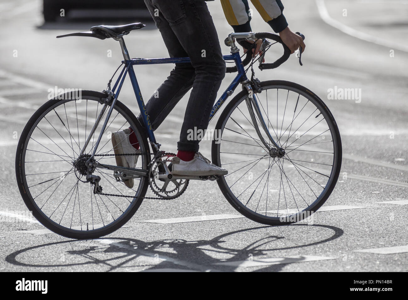 Cyclist on bicycle crossing the street hi-res stock photography and ...