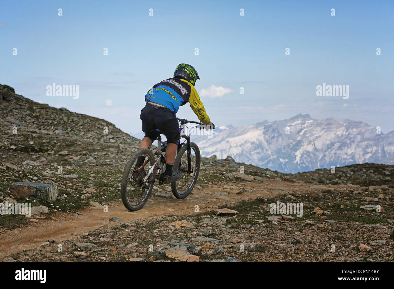 mountain biker on downhill track Stock Photo - Alamy