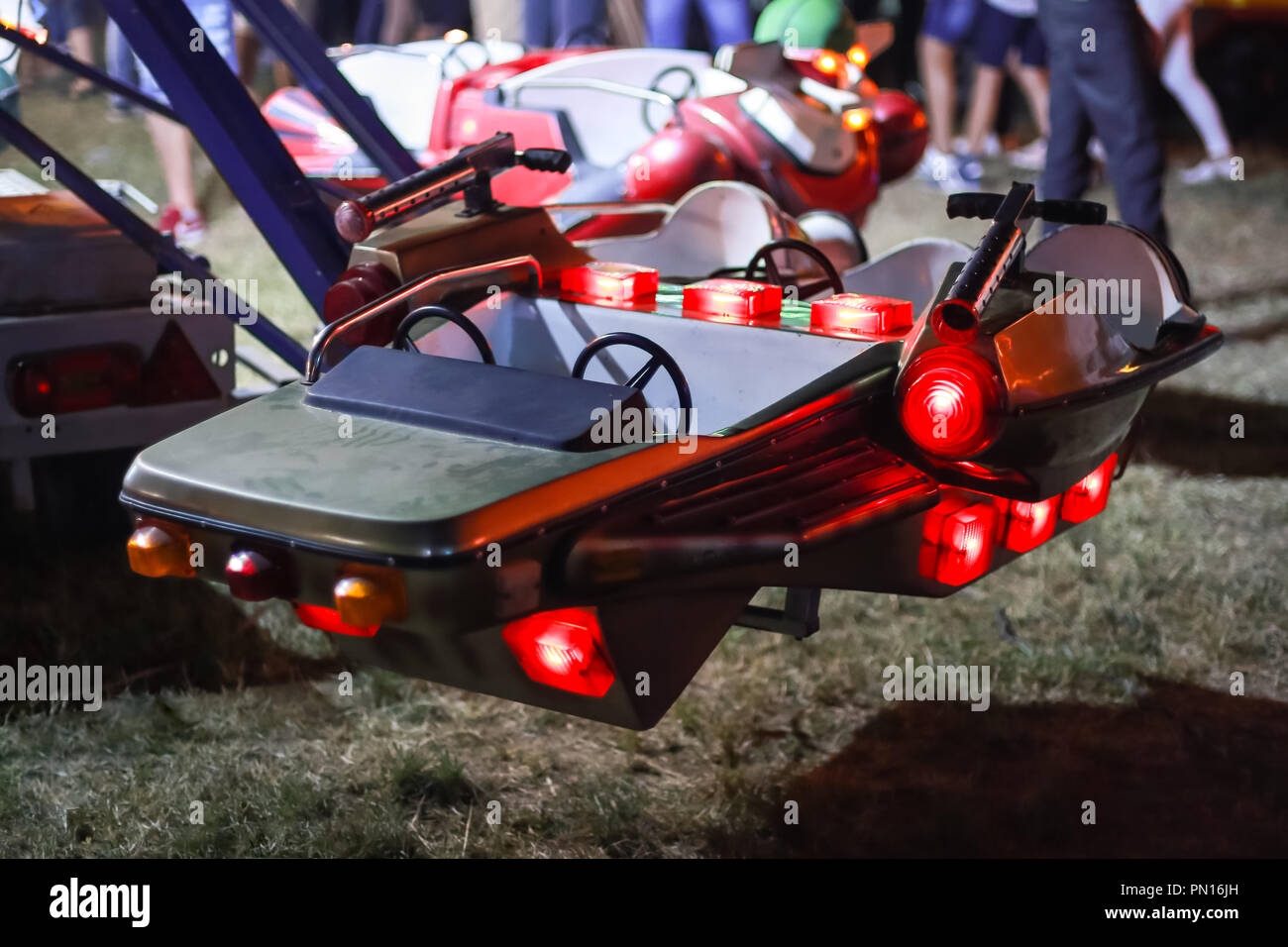 A detail of a car on a carousel in an amusement park Stock Photo - Alamy