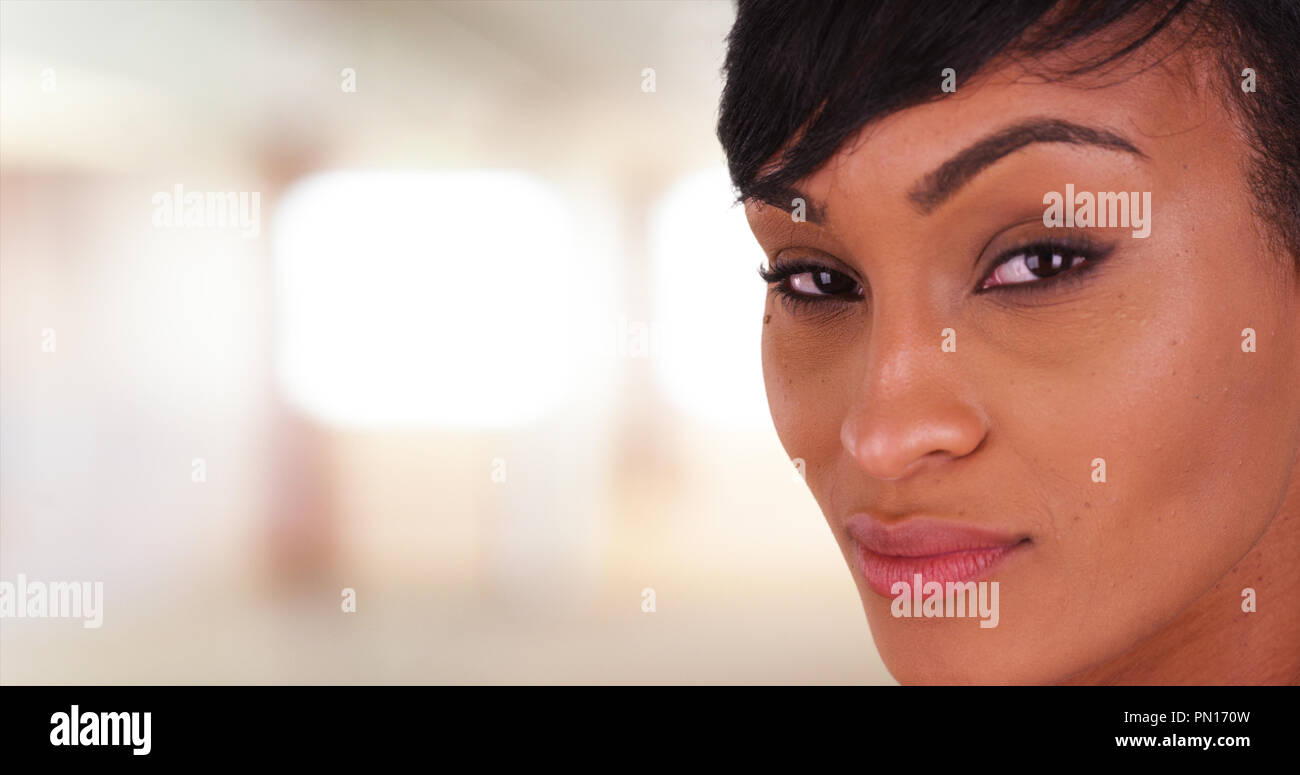 Side view of Beautiful woman turning to face camera Stock Photo - Alamy