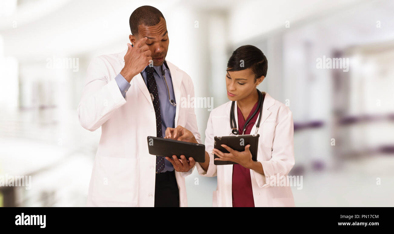African american nurse using video hi-res stock photography and images ...