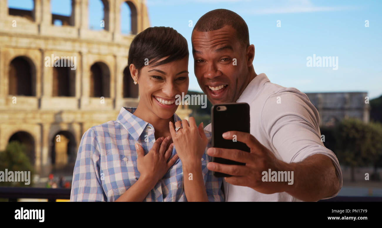 African male in Rome taking selfies with fiance with her new wedding ...