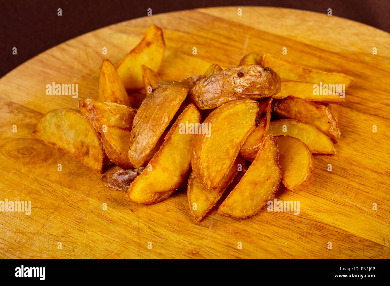 French fried potato over wooden Stock Photo - Alamy