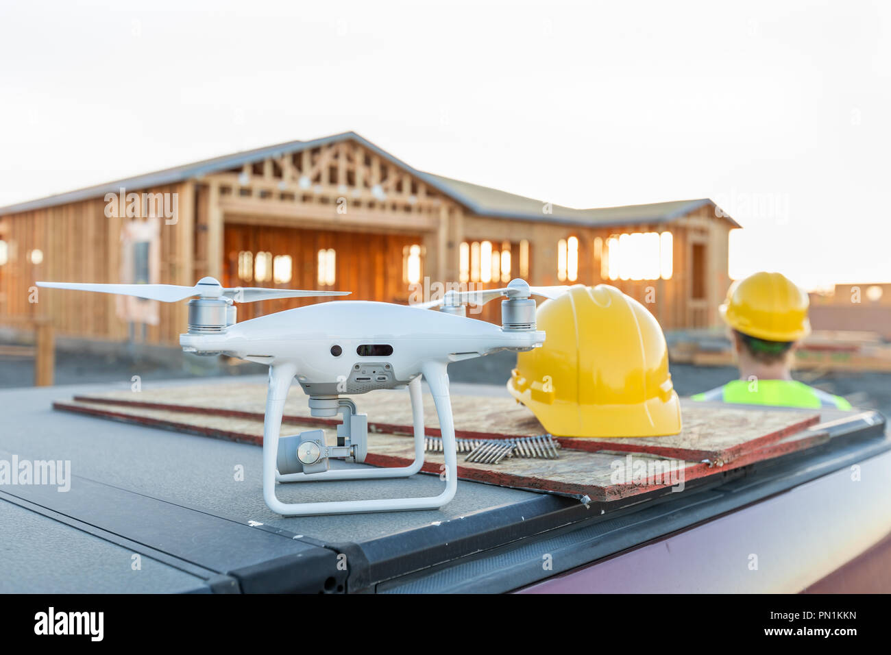 Drone Quadcopter Next to Hard Hat Helmet At Construction Site with ...