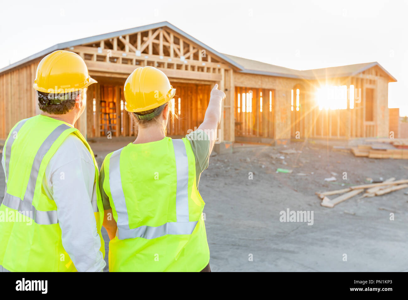 Male and Female Construction Workers at New Home Site Stock Photo - Alamy