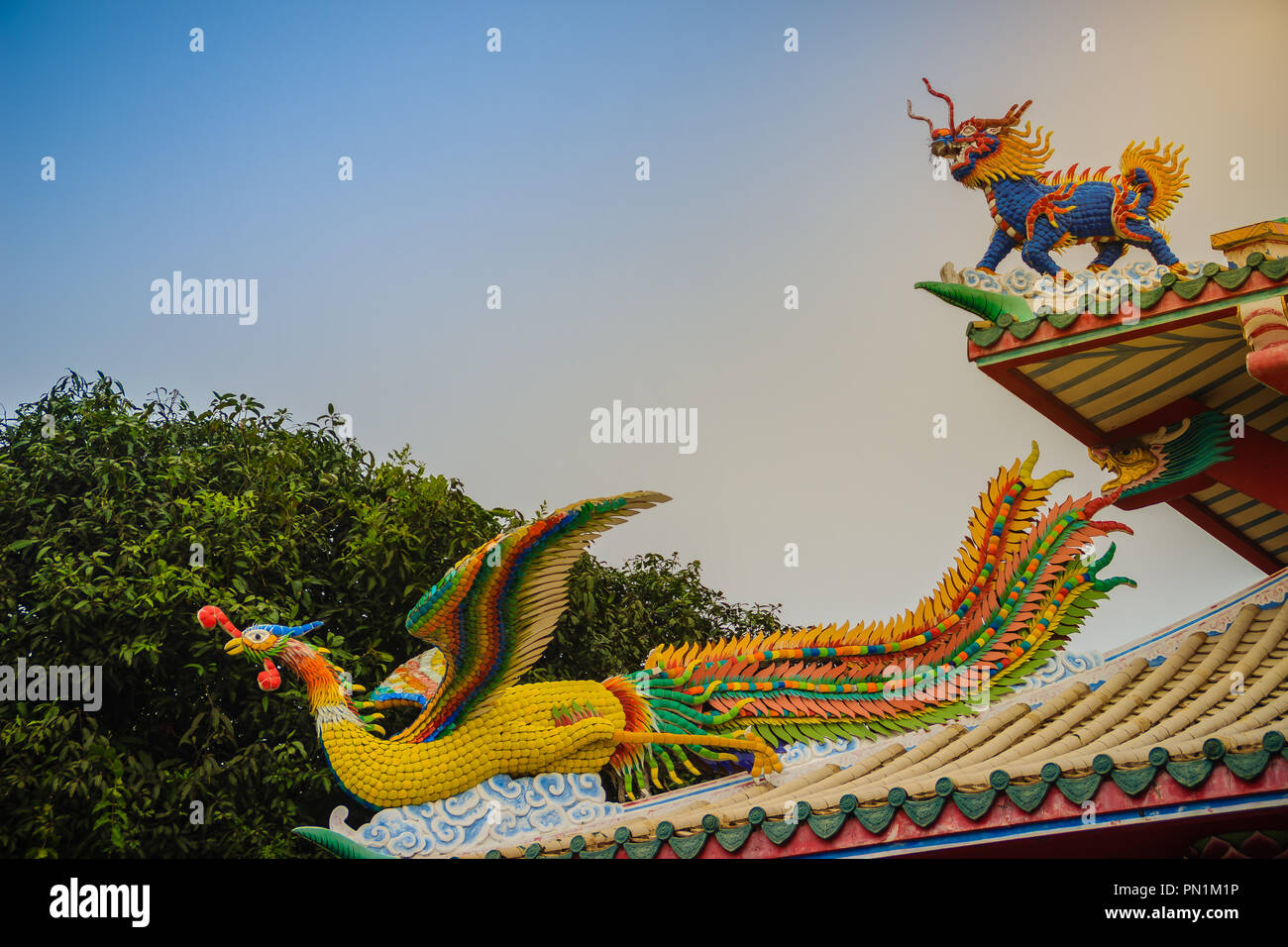 Beautiful Chinese dragon-headed unicorn and Chinese phoenix statues on ...