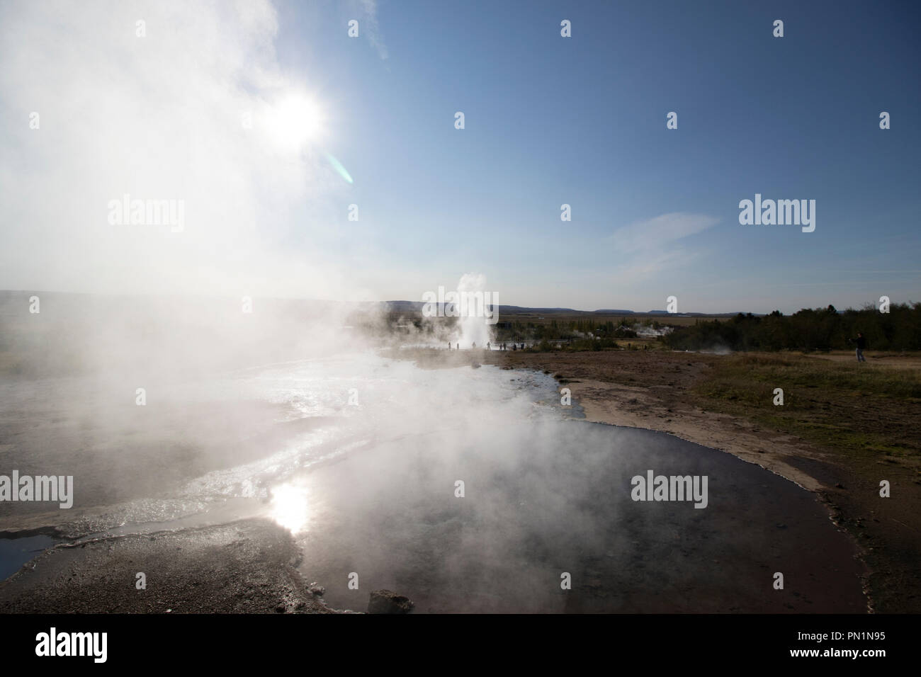 Cloud forming off the surface of boiling water at a geyser in Iceland ...