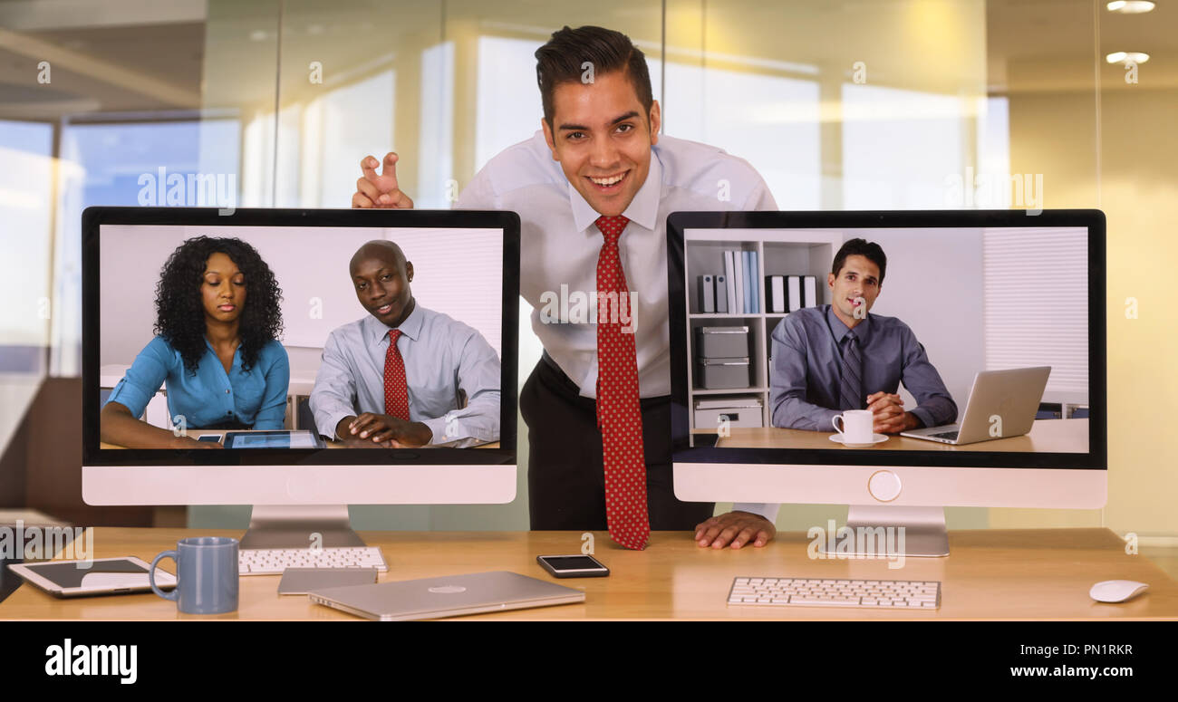 Business man giving bunny ear to colleague on computer screen making ...