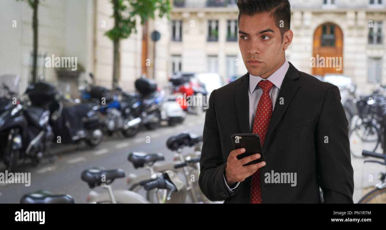 Young handsome businessman checks hi-res stock photography and images ...