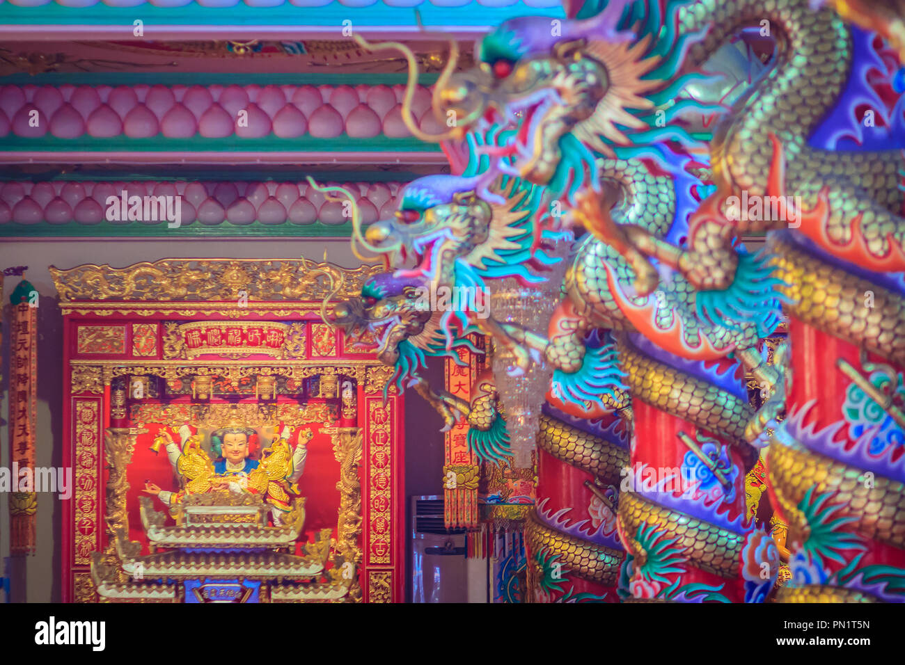 Colorful dragons and statue of Nezha, the protective deity in Chinese ...