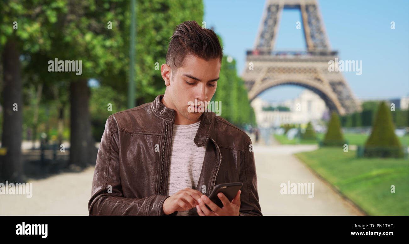 Young man answers mobile phone hi-res stock photography and images - Alamy