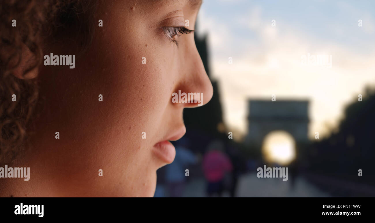 Close up of sad young woman staring at the ground outside grief ...