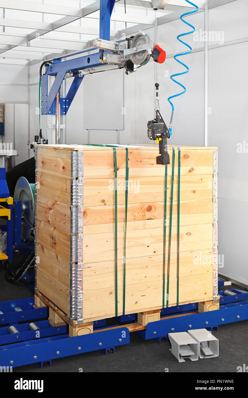 Wood crate secure packing at conveyor rollers Stock Photo - Alamy