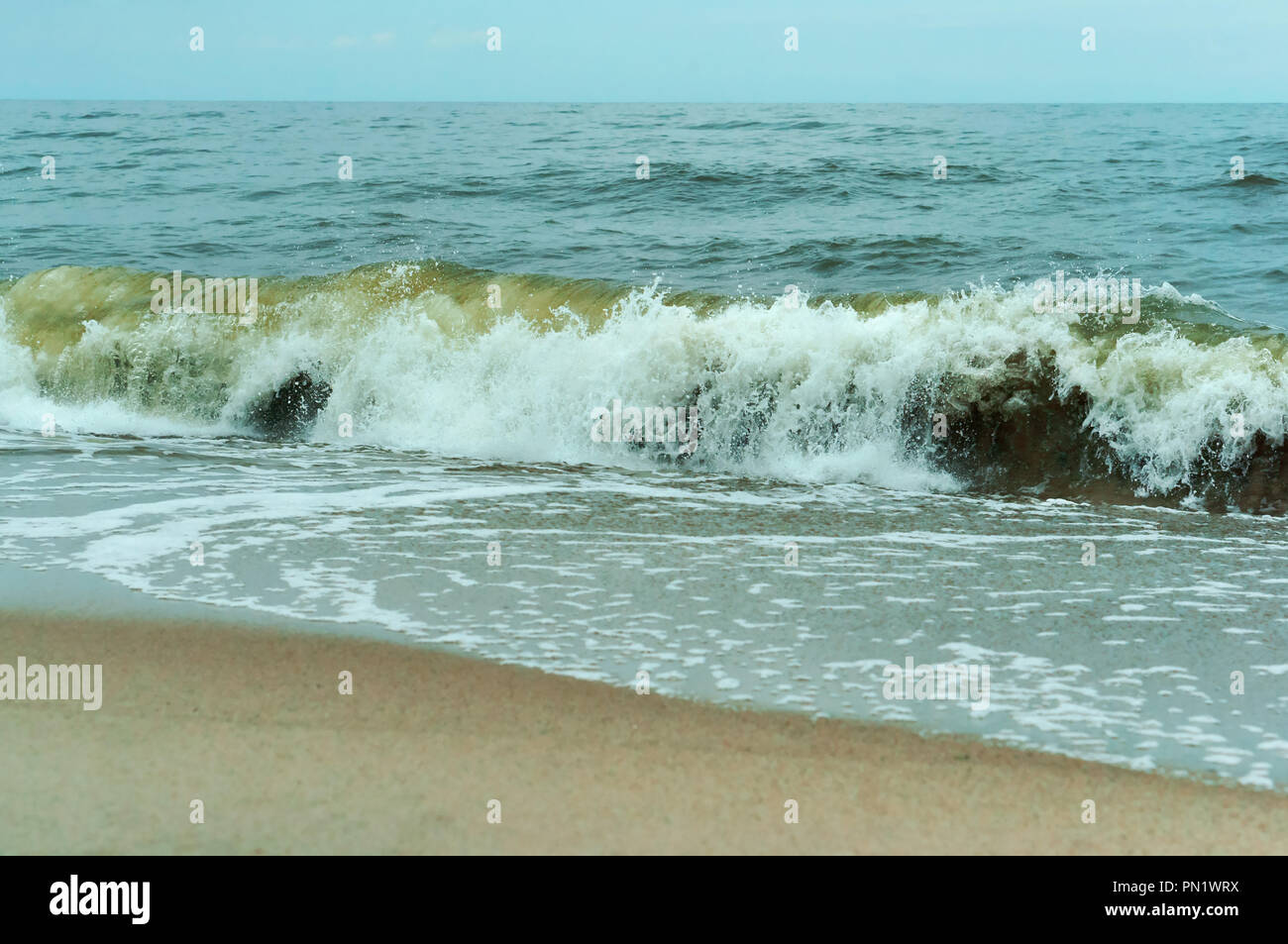 ice sludge in the sea, oil platform in the winter sea on the horizon ...