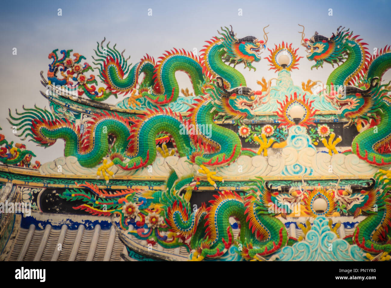 Colorful chinese dragon statues on roof in Chinese temple. Chinese ...