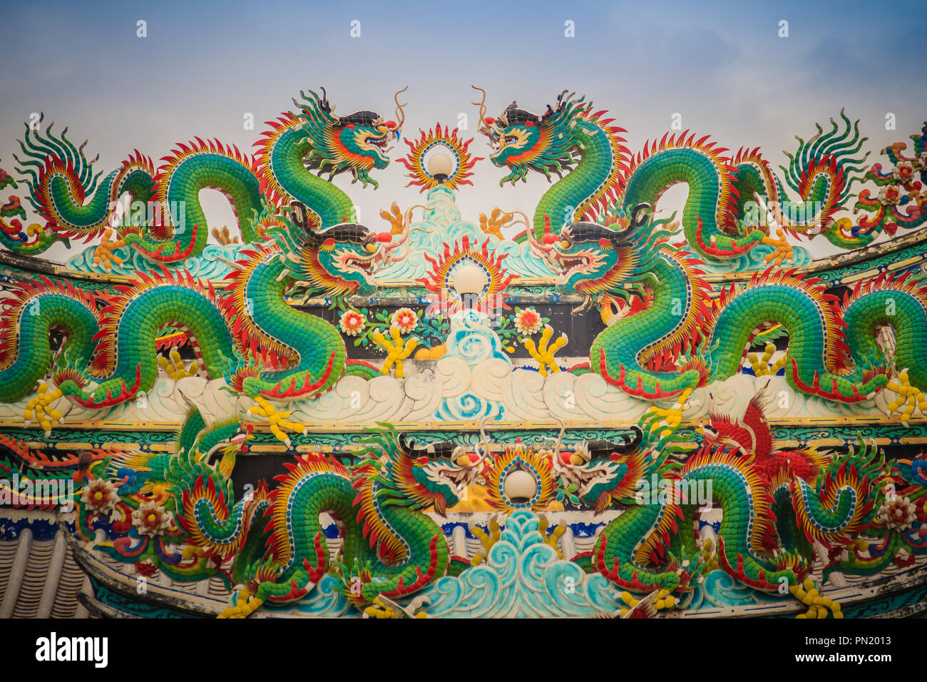 Colorful chinese dragon statues on roof in Chinese temple. Chinese ...