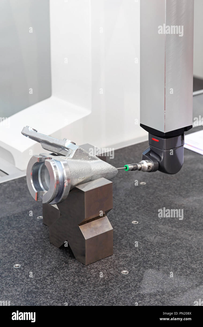 Testing metal product with precision measuring instrument probe Stock ...
