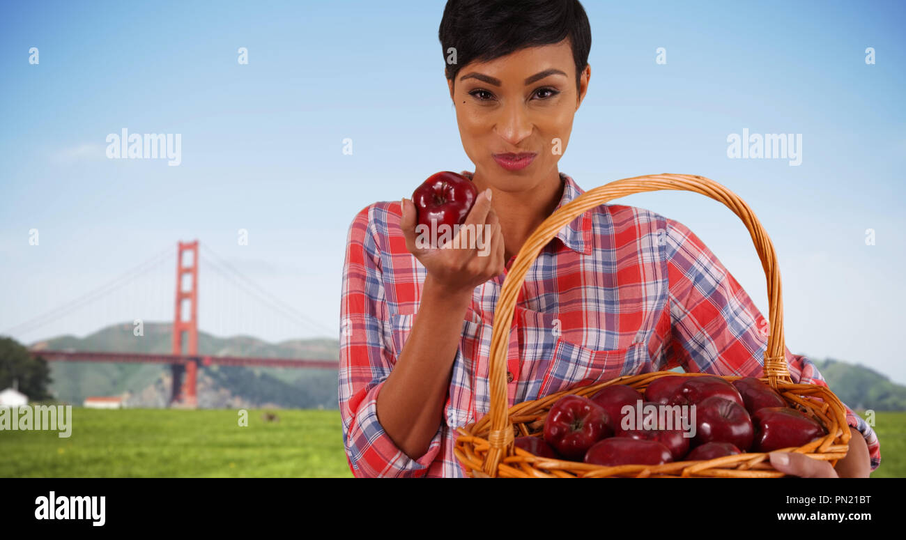 Girl taking bite apple apple hi-res stock photography and images - Alamy