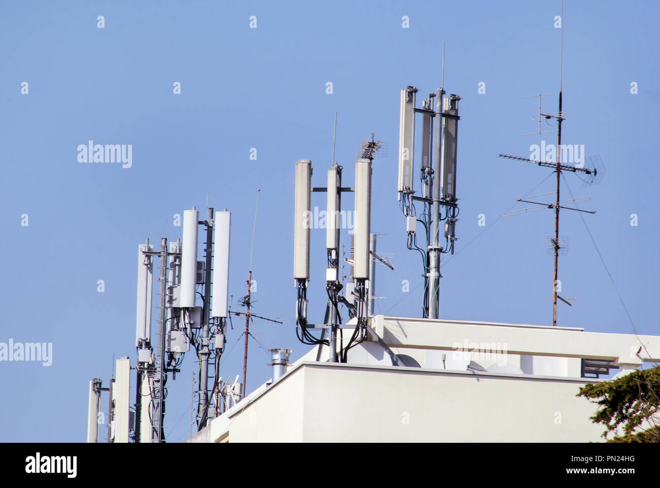 Telecommunication base stations network repeaters on the roof of the ...