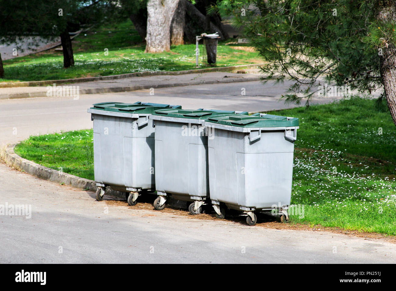 Old metal garbage containers on the street, trash dumpsters. Dirty ...