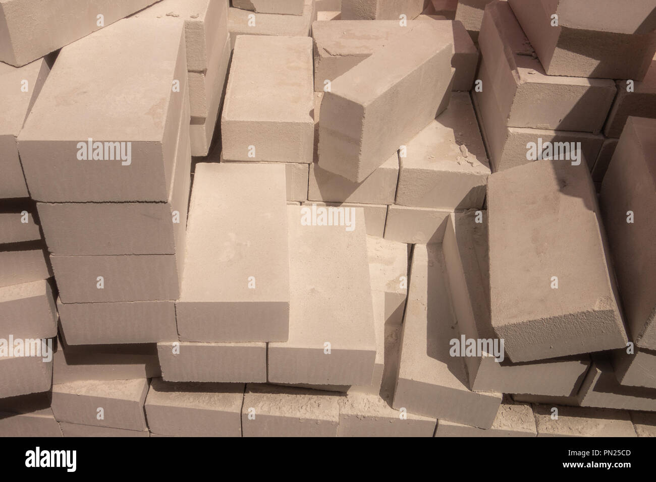 Piled up a big pile of white bricks Stock Photo - Alamy