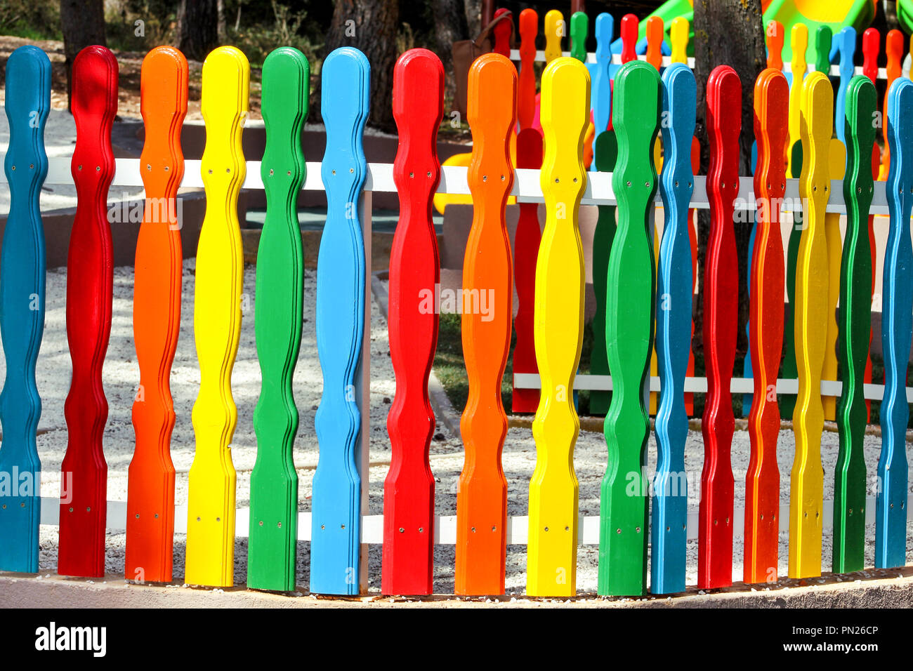Colorful wooden decorative fence in the city park. Landscape ...